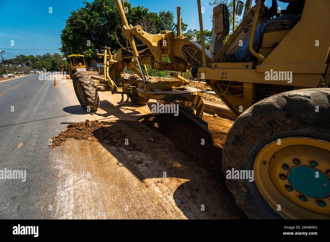 Details of grader is working on road construction. Grader industrial ...