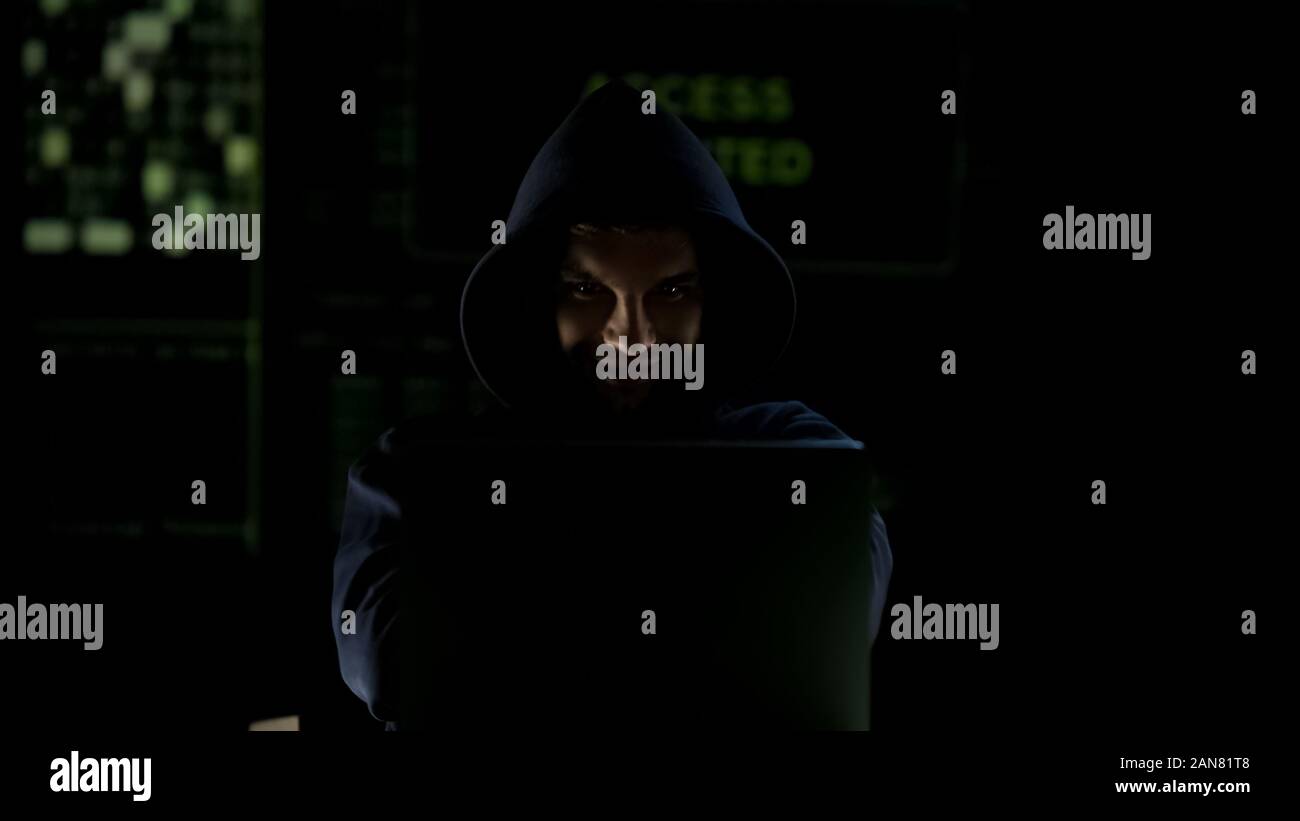 Cybercriminal happy satisfied success in hi-res stock photography and ...