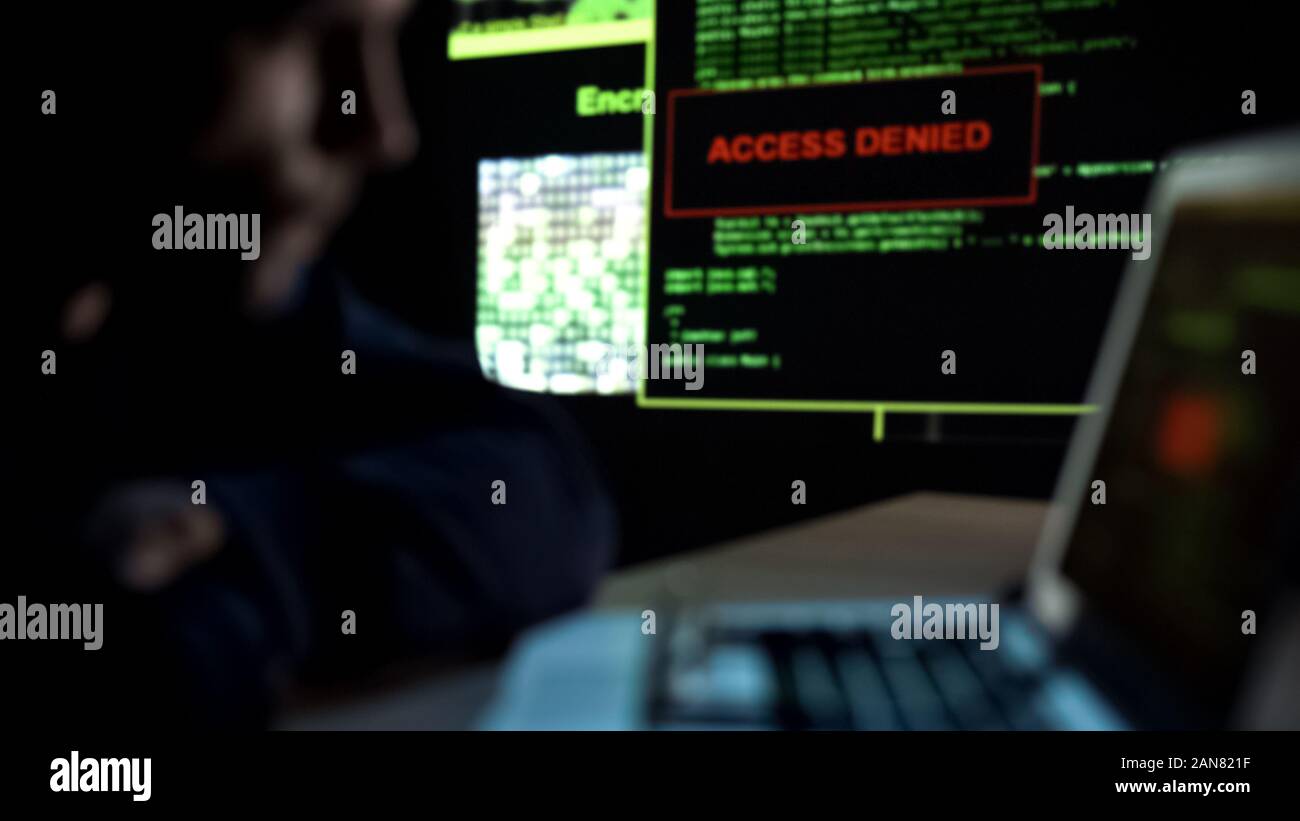 Administrator sees message Access denied on monitor, server hacking attempt Stock Photo - Alamy