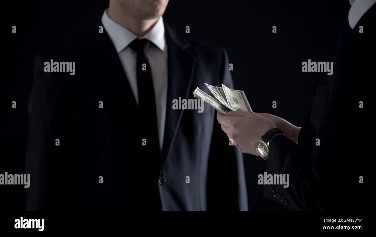 Income tax inspector counting money, covering up illegal business ...