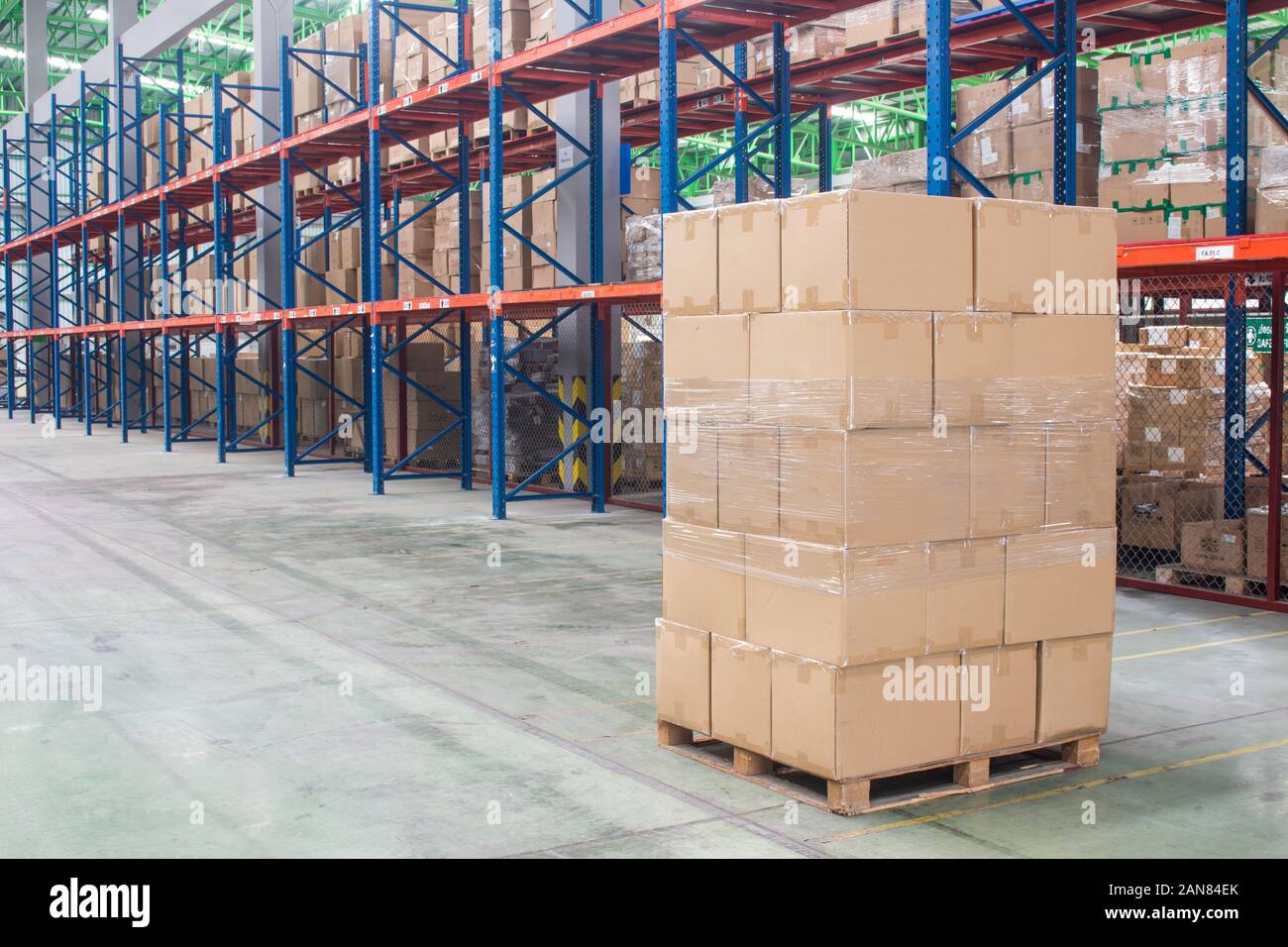 Rows of material boxes or product boxes in warehouse area Stock Photo ...