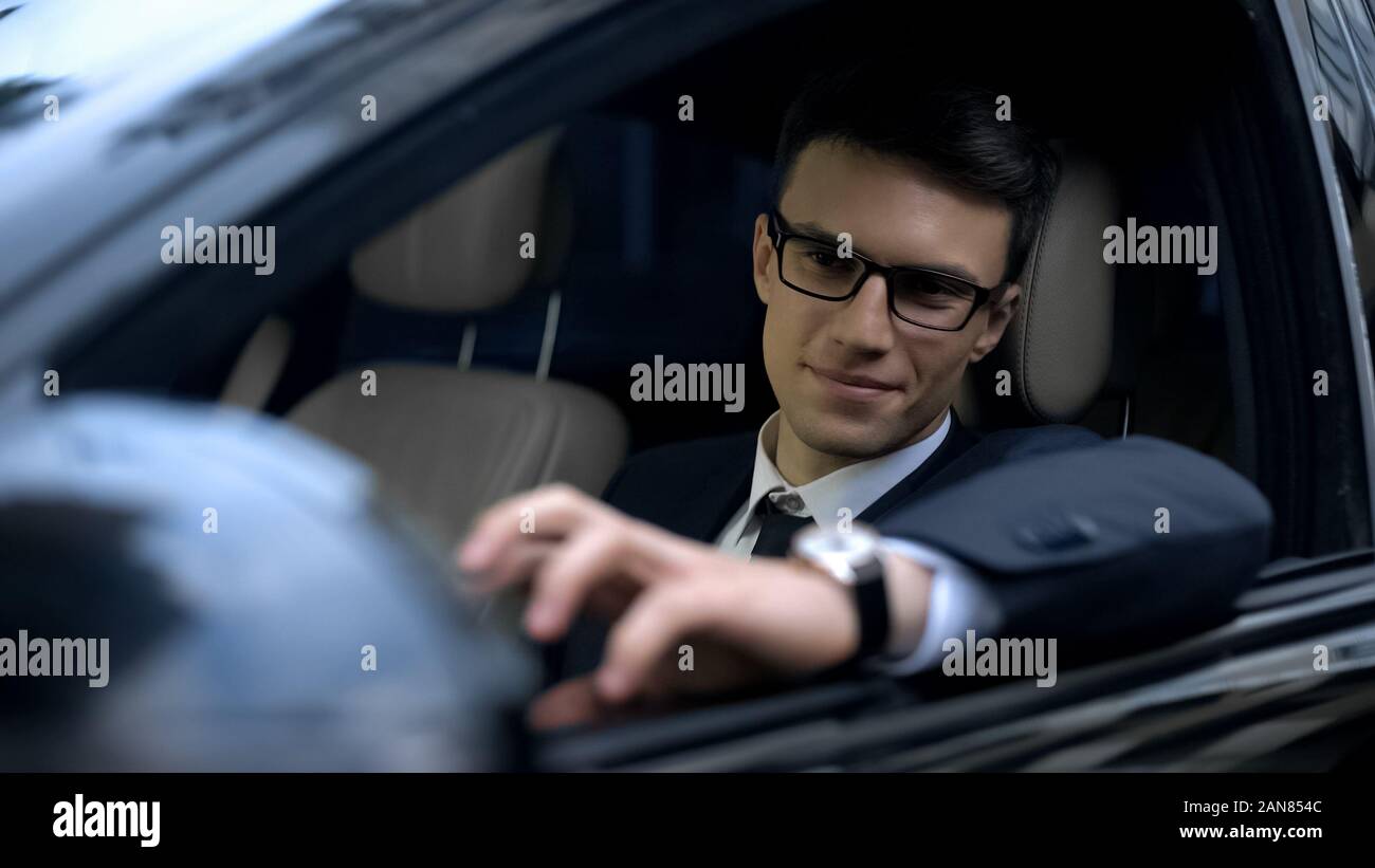 Man looking rear view mirror in car hi-res stock photography and images ...