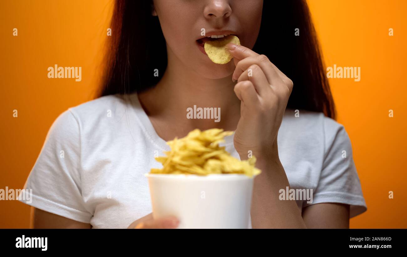 Fat girl eating chips hi-res stock photography and images - Alamy