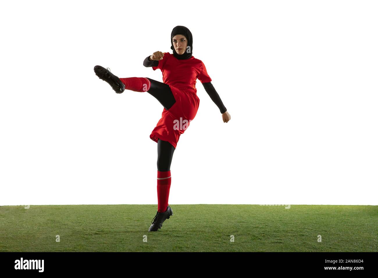 Arabian female soccer or football player isolated on white studio ...