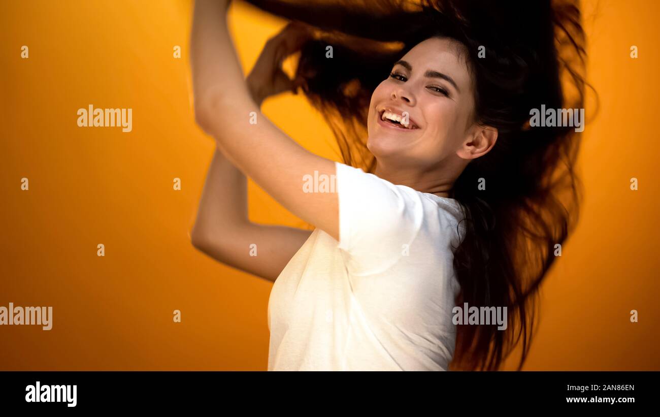 Beautiful girl throwing hair hi-res stock photography and images - Alamy