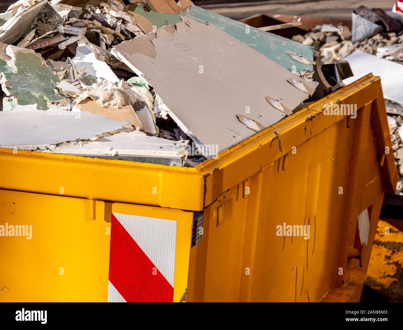 Container with drywall rubble construction site Stock Photo - Alamy