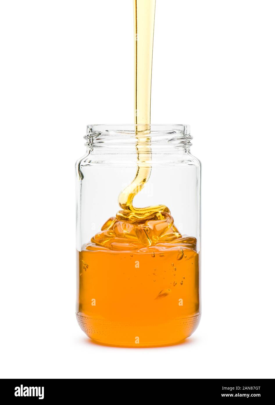 Honey spilling in glass jar, on white background Stock Photo - Alamy