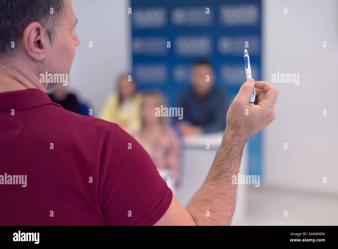 Male Professor Holding Lecture to Multi Ethnic Group of Students. Smart ...