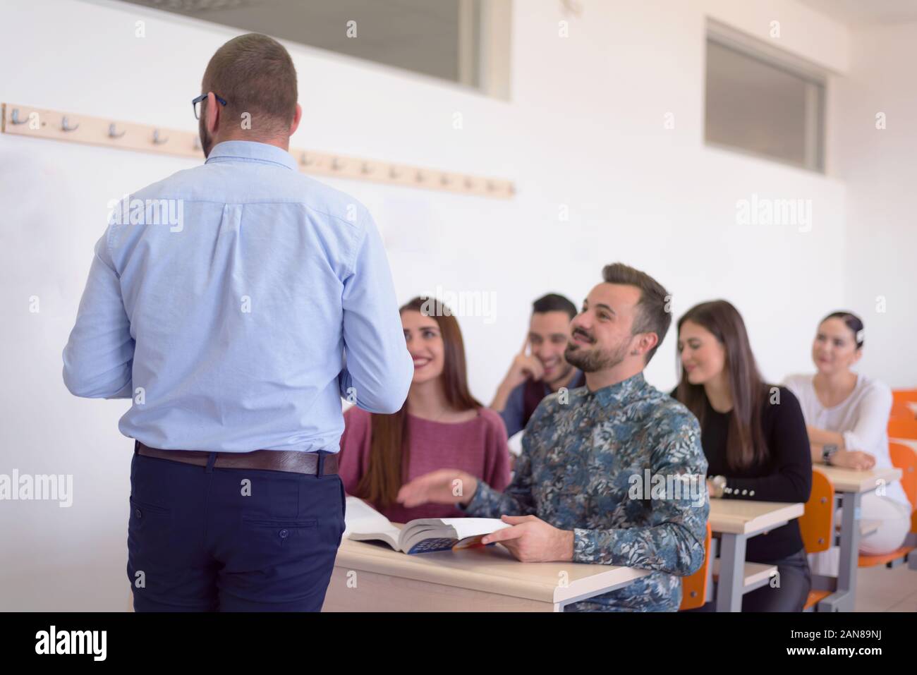 Male Professor Holding Lecture to Multi Ethnic Group of Students. Smart ...