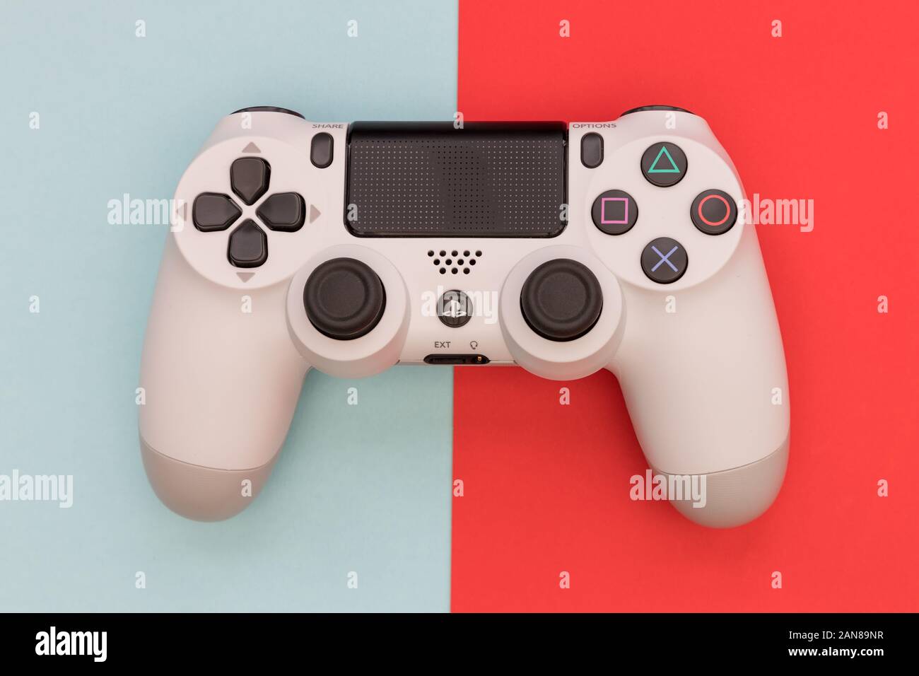 LONDON - DECEMBER 10, 2019: Video game gaming controller on bright red ...
