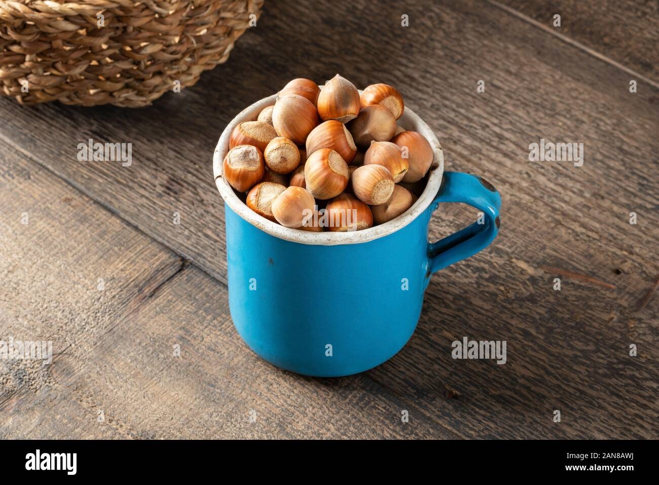 Hazelnuts in a blue pot Stock Photo - Alamy