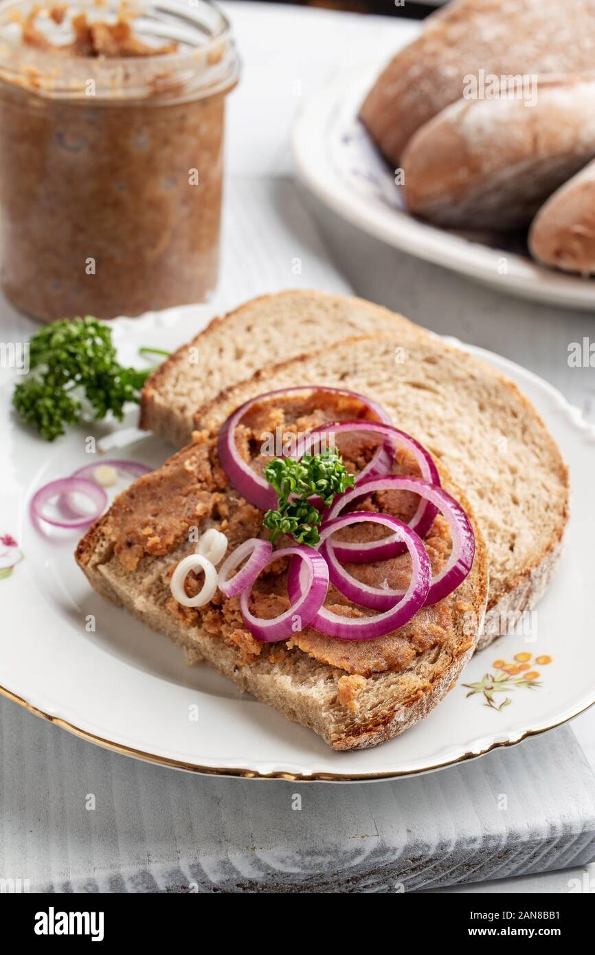 Slices of bread slathered with pork lard mixed with ground cracklings ...