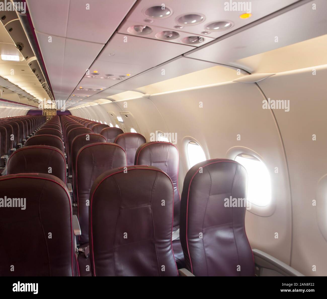 interior of airplane with chair and white window Stock Photo - Alamy