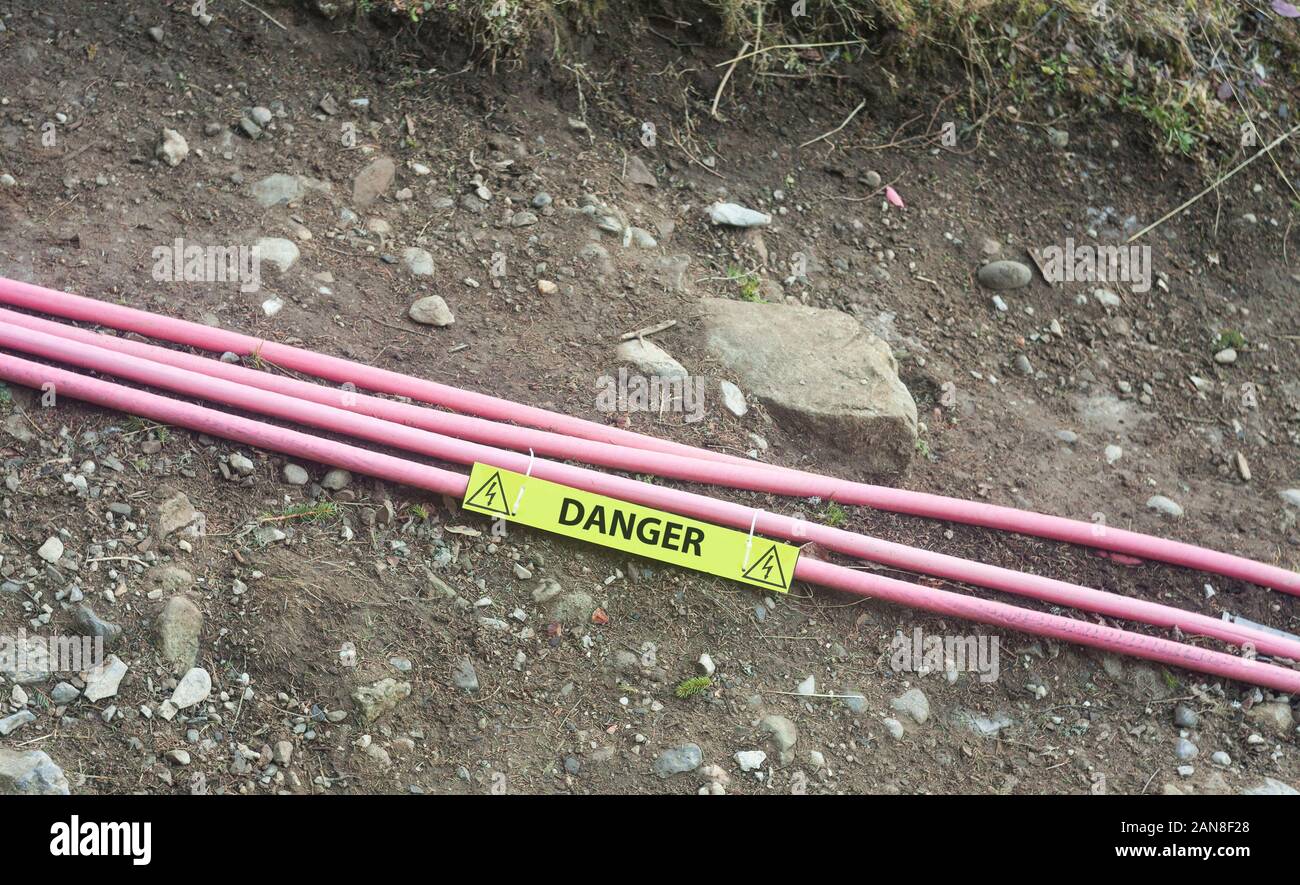 wire cables for electricity out on the ground. danger concept Stock ...