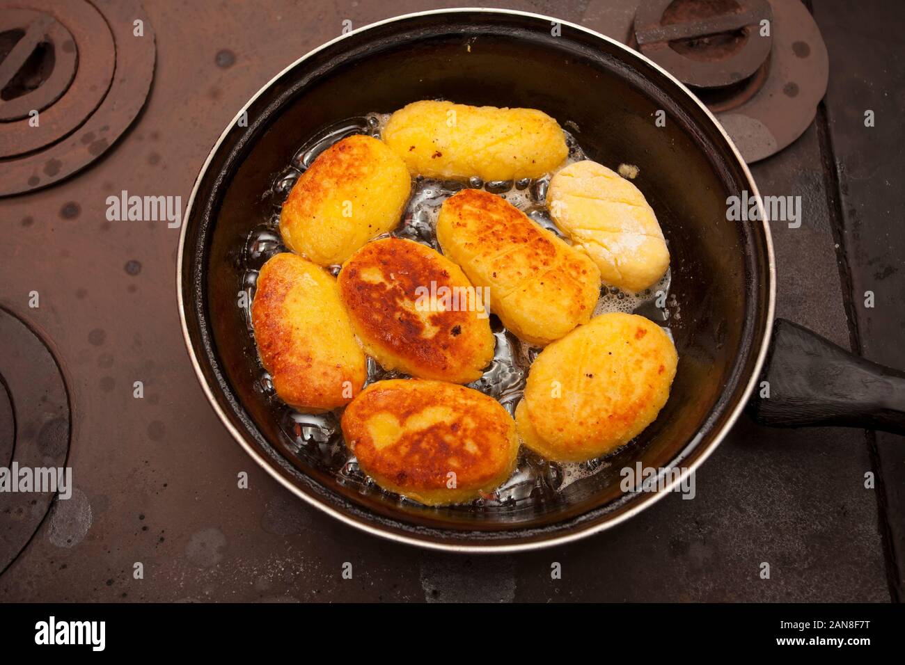 roasted and boiled donuts in the pan Stock Photo - Alamy