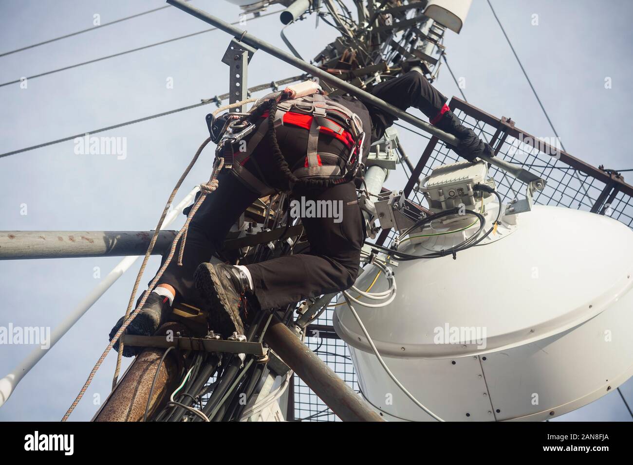 Worker climbing utility pole hi-res stock photography and images - Alamy
