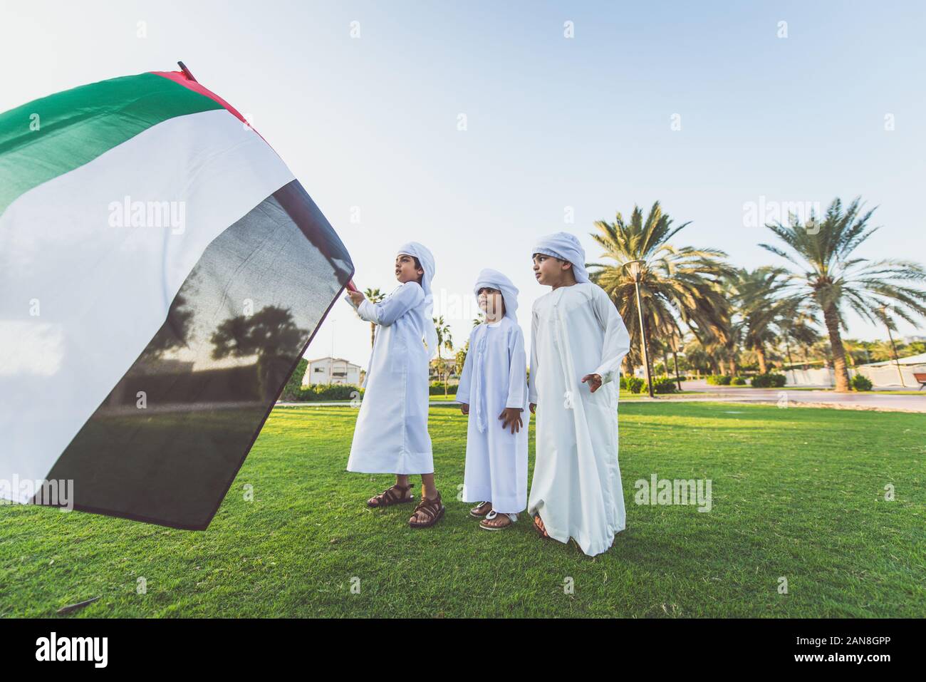 Children playing traditional uae hi-res stock photography and images ...