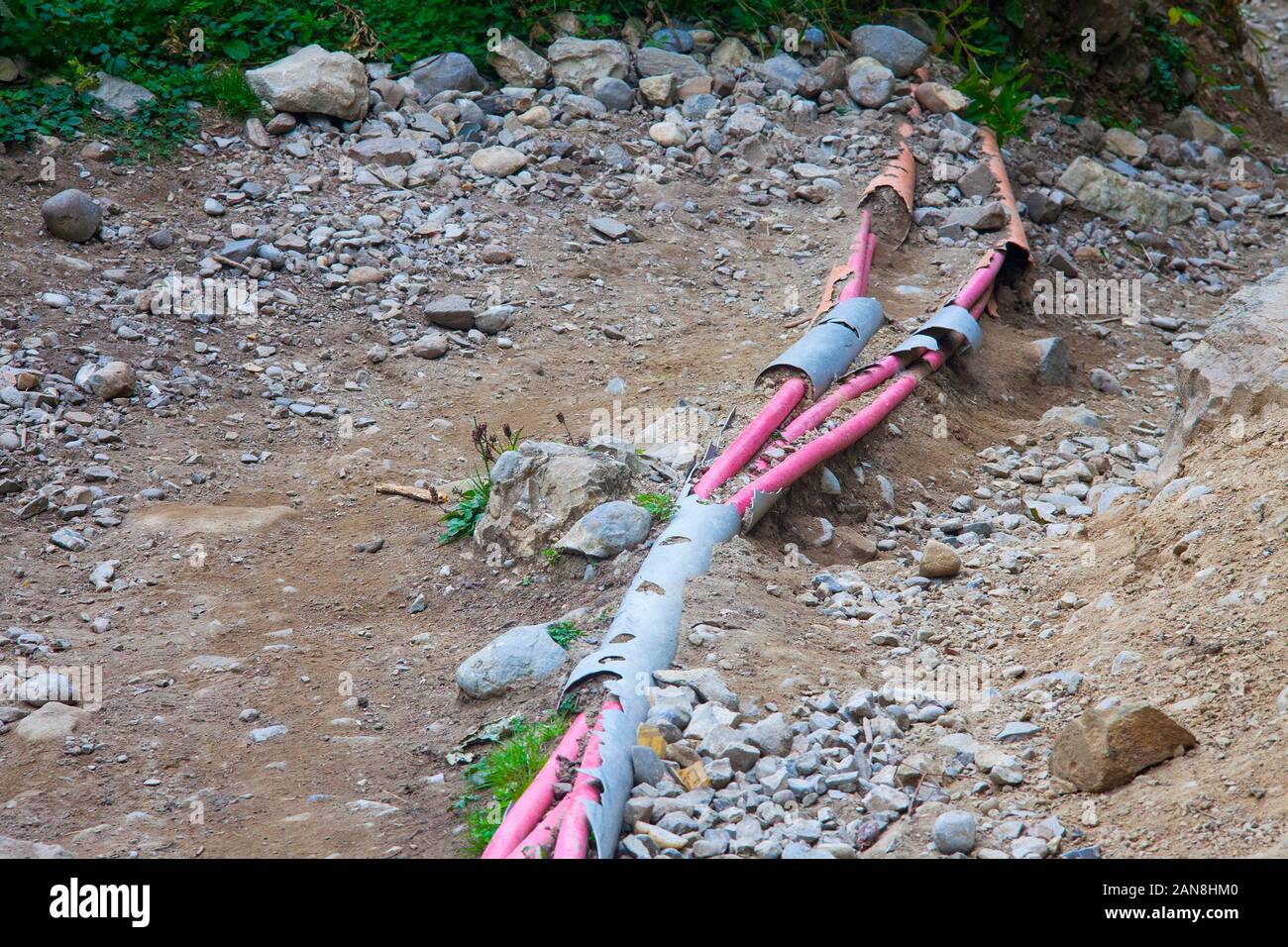broken cable in the ground. dangerous scene Stock Photo - Alamy