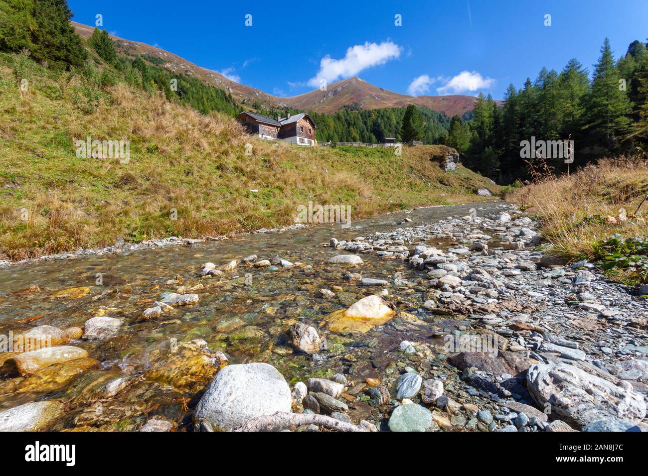 The upper course of the Mur (Mura) River, with a lonely house in ...