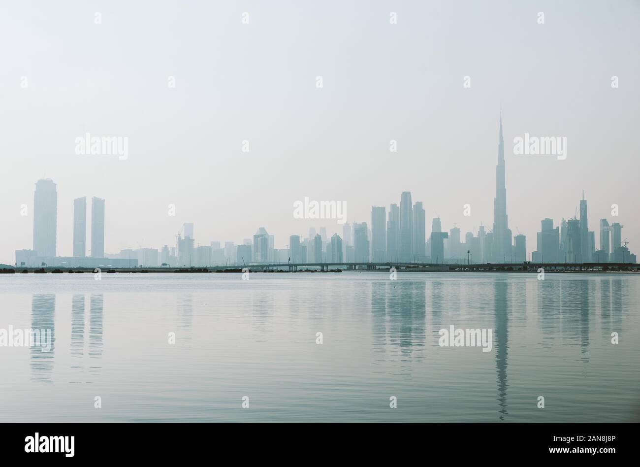 Dubai skyline with water reflection Stock Photo - Alamy