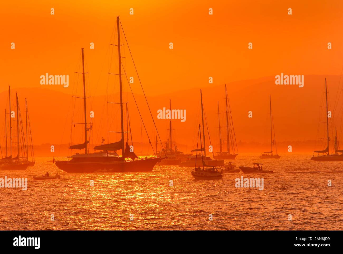 sail boats and yacht at sea sunset. Saint Tropez, France Stock Photo ...