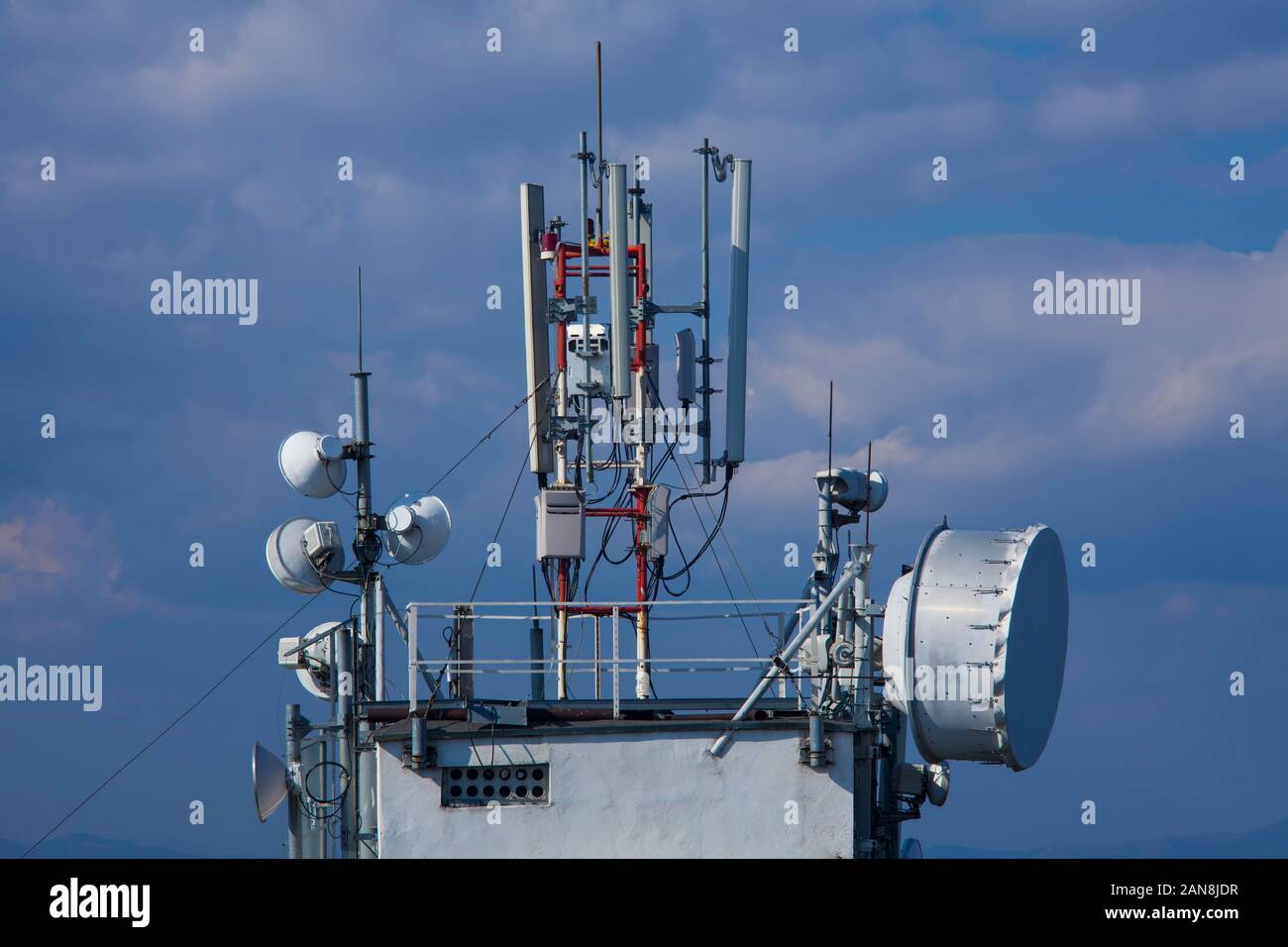 building with radio antenna for transmitting signal Stock Photo - Alamy