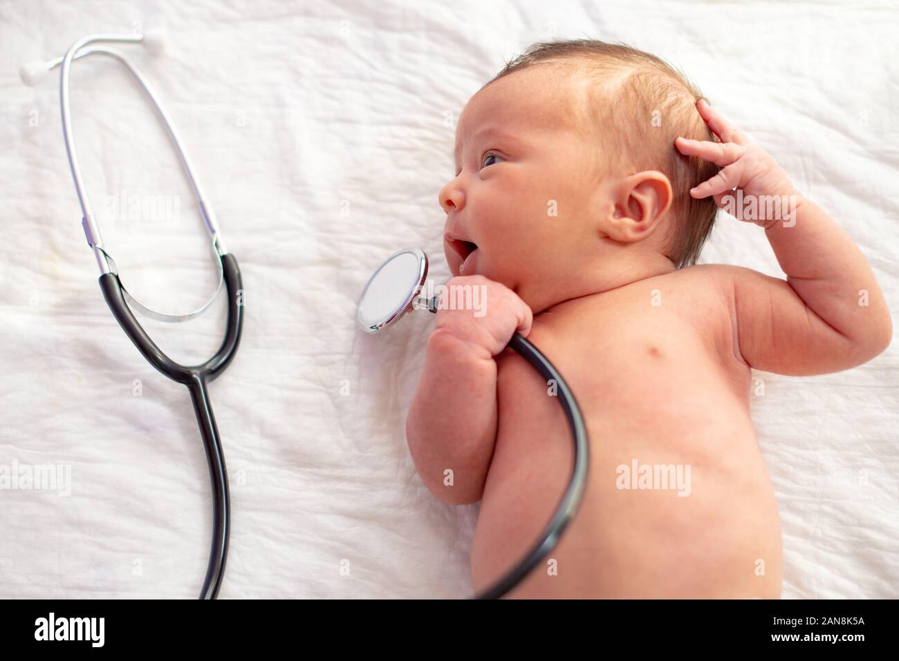 medical instruments stethoscope in hand of newborn baby girl Stock ...