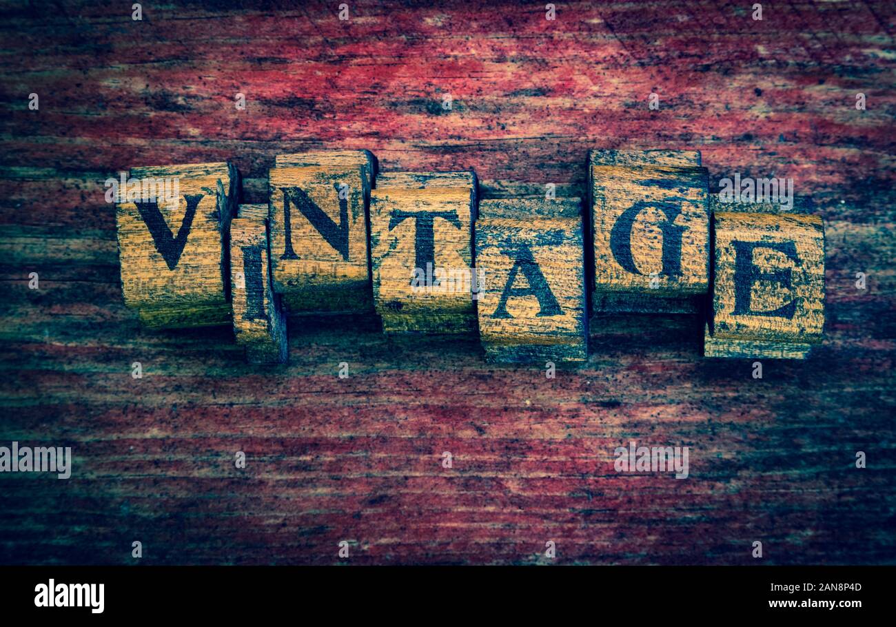 Vintage wooden stamps text letters, faded grunge wooden background ...