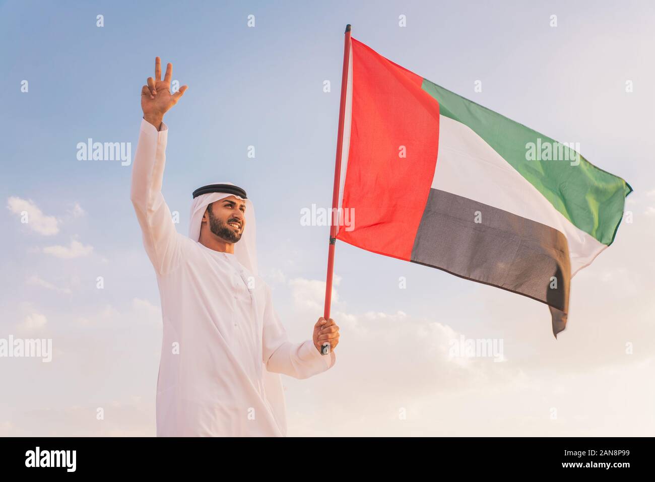 business men wearing traditional uae white kandura spending time in the ...