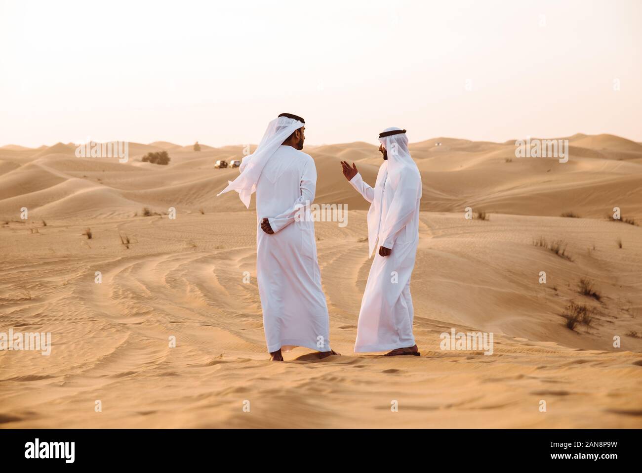 Two men walking talking wearing hi-res stock photography and images - Alamy