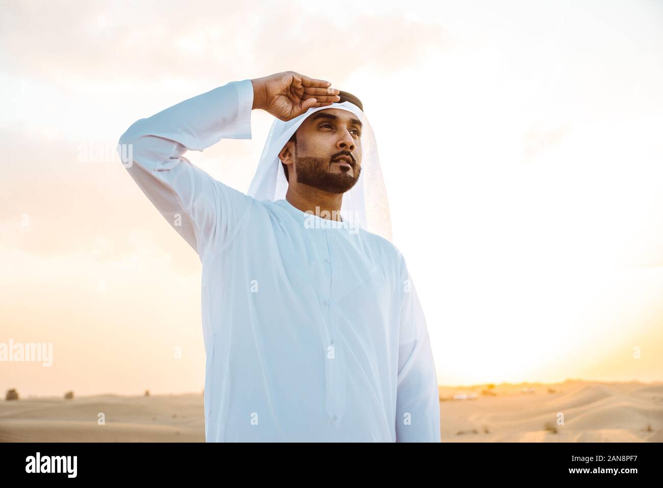 business men wearing traditional uae white kandura spending time in the ...