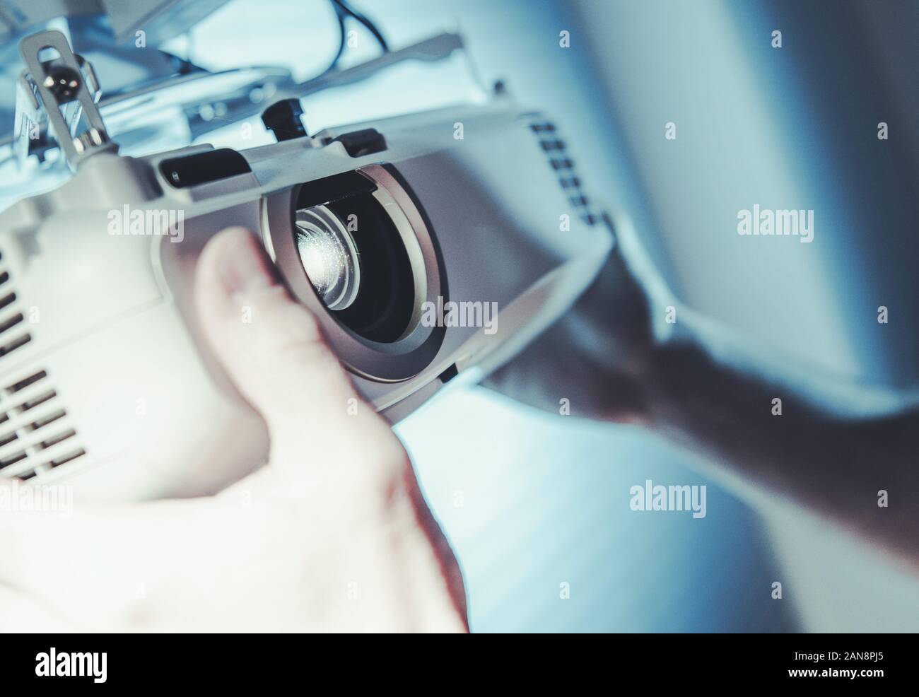 Caucasian Men Adjusting Home Theatre Projector. Closeup Photo Stock ...