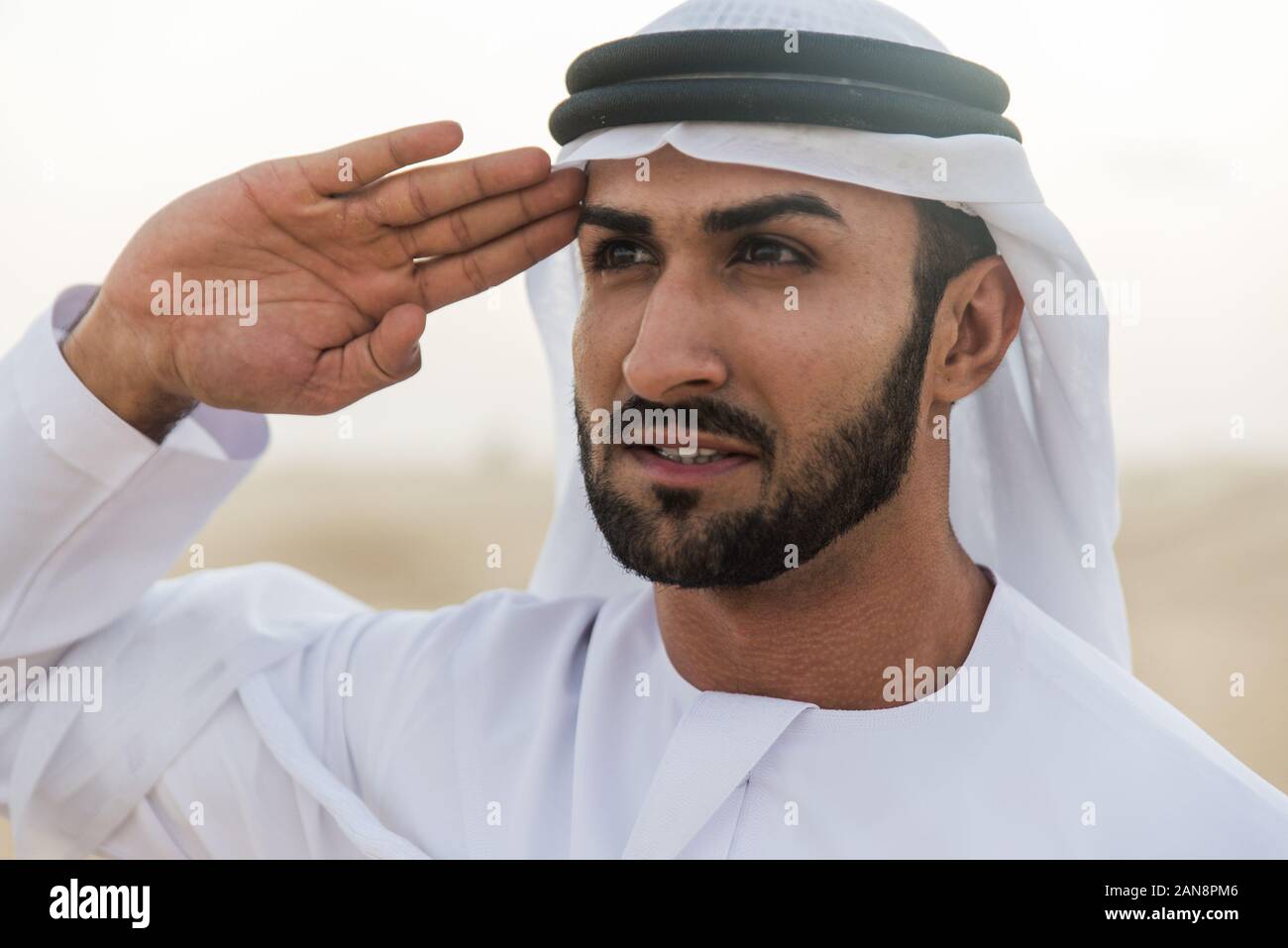business men wearing traditional uae white kandura spending time in the ...