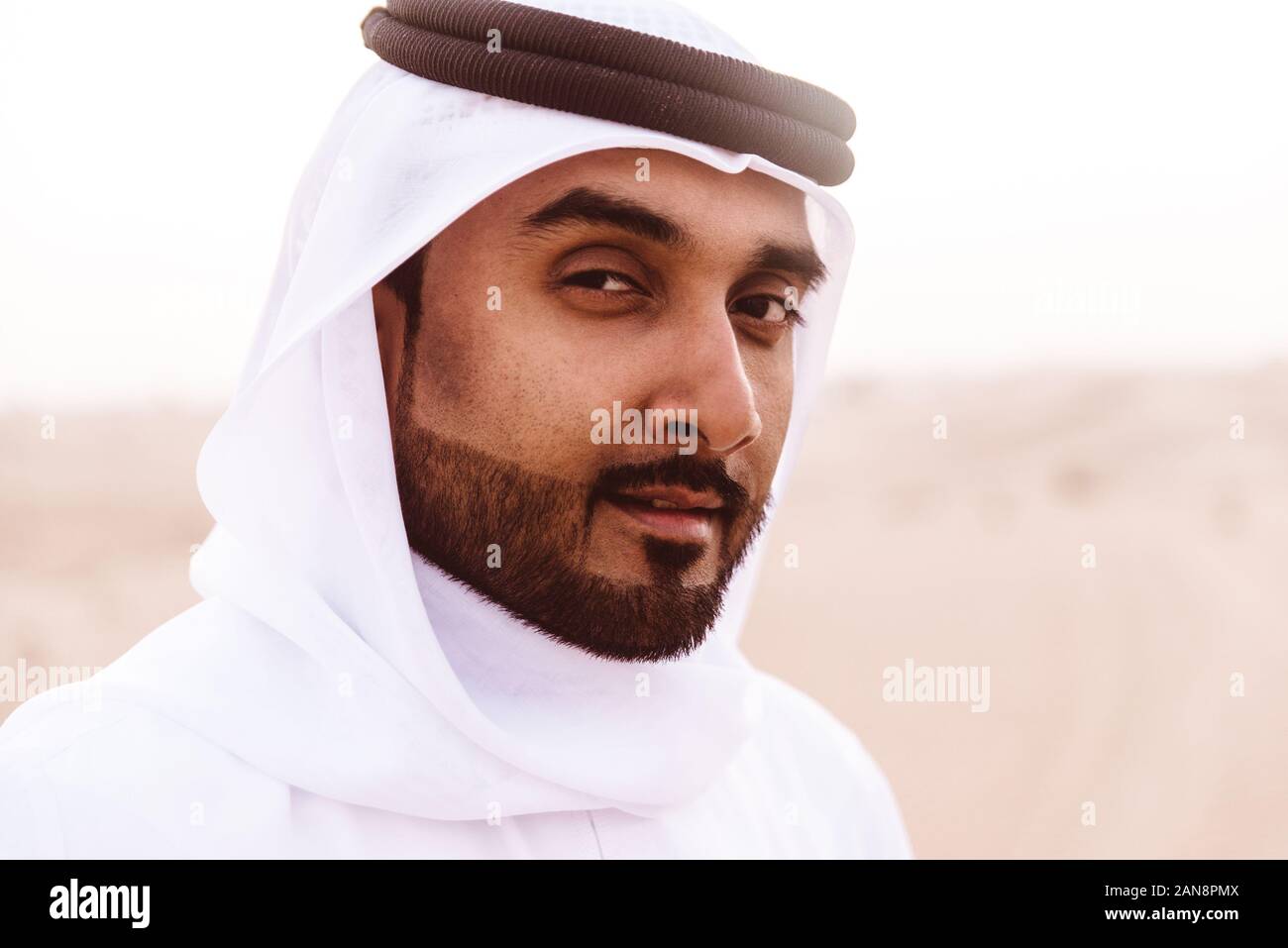 Business men wearing traditional uae white kandura spending time in the ...