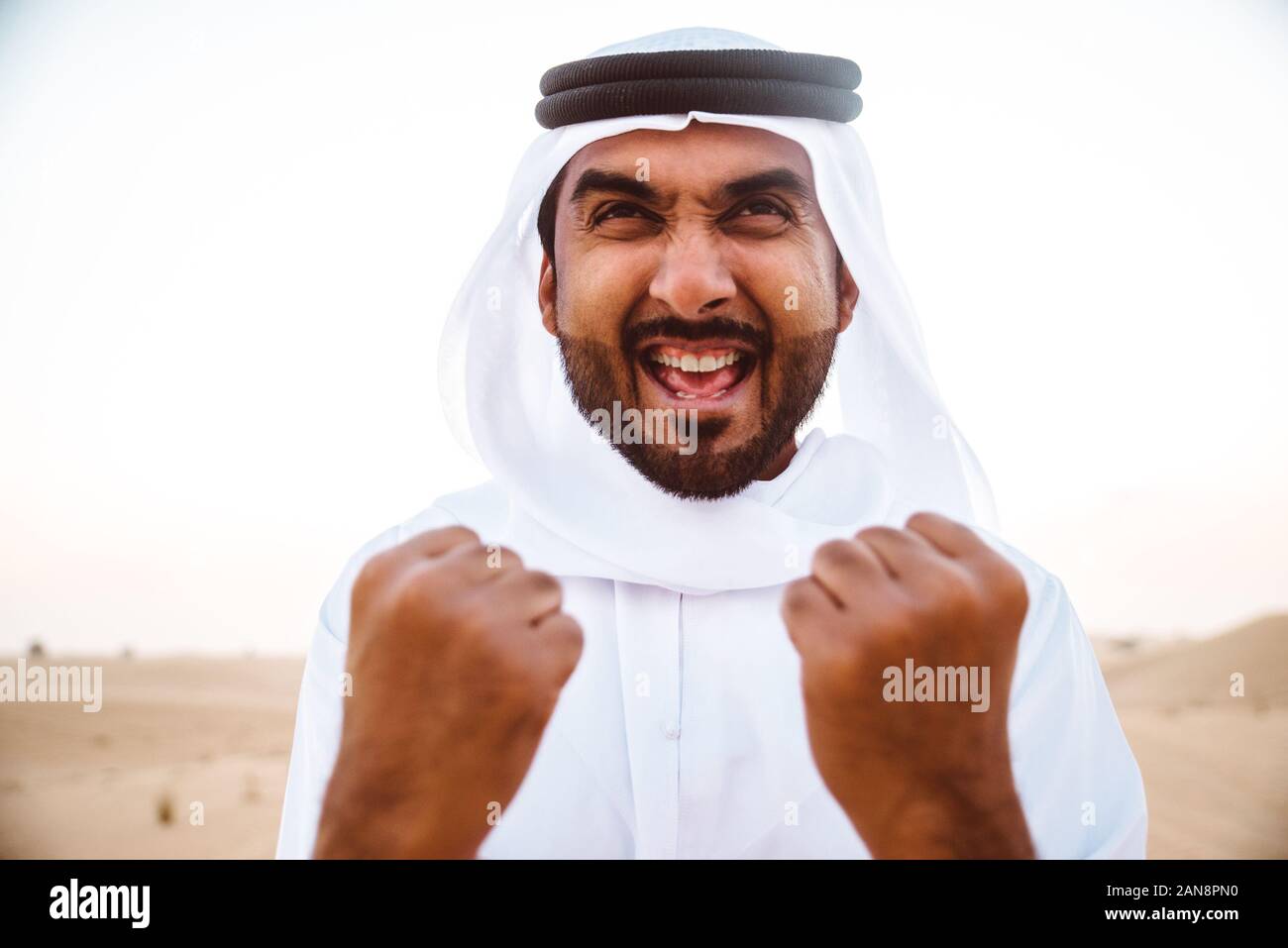 Business men wearing traditional uae white kandura spending time in the ...