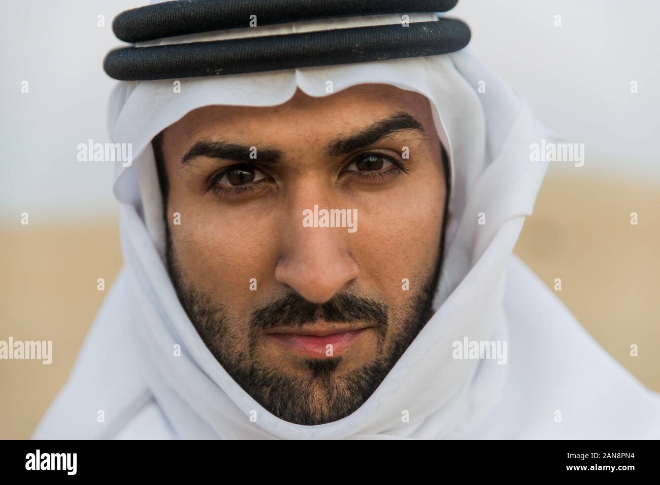 business men wearing traditional uae white kandura spending time in the ...