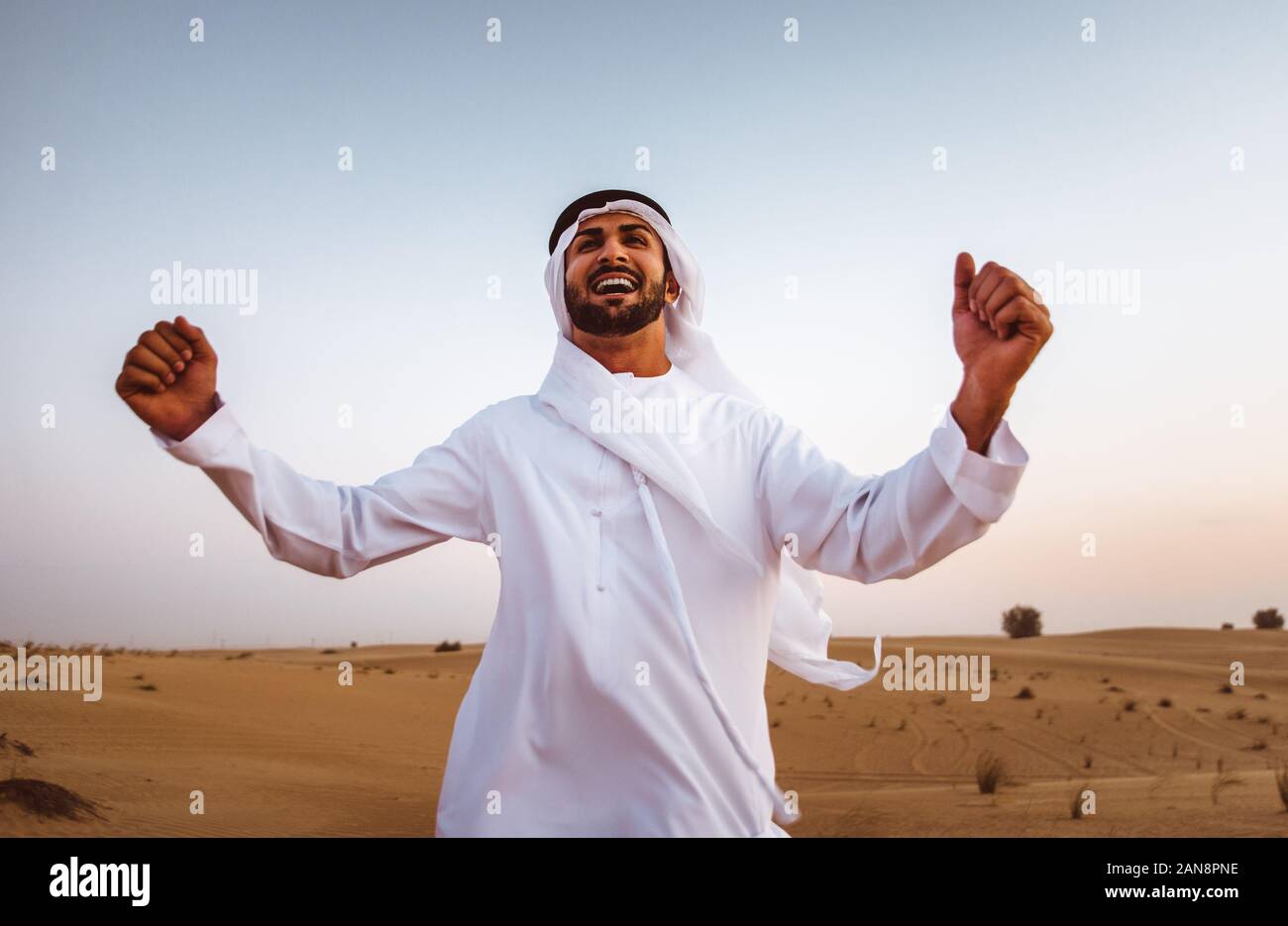 Business men wearing traditional uae white kandura spending time in the ...