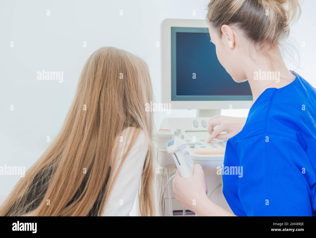 Female Doctor Preparing USG Ultrasonography Device to Perform Child ...