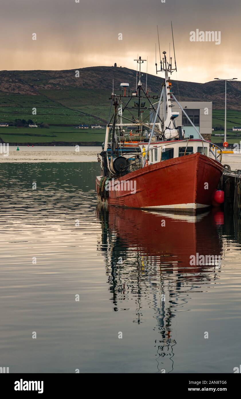 Fishing boat docked in Dingle bay harbour in County Kerry Stock Photo ...