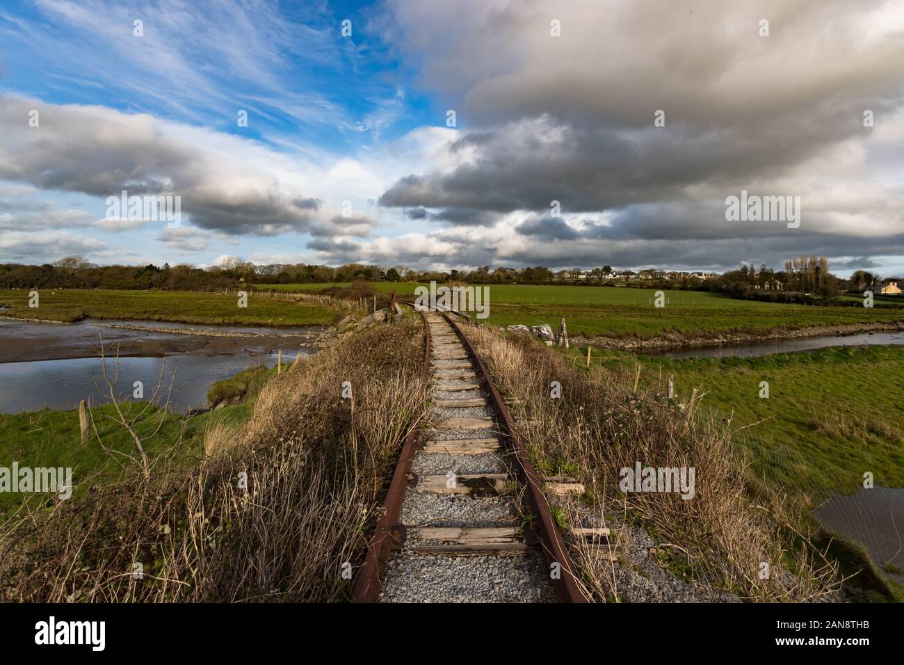 landscape of old unused and abandonned rusty train tracks in rural ...