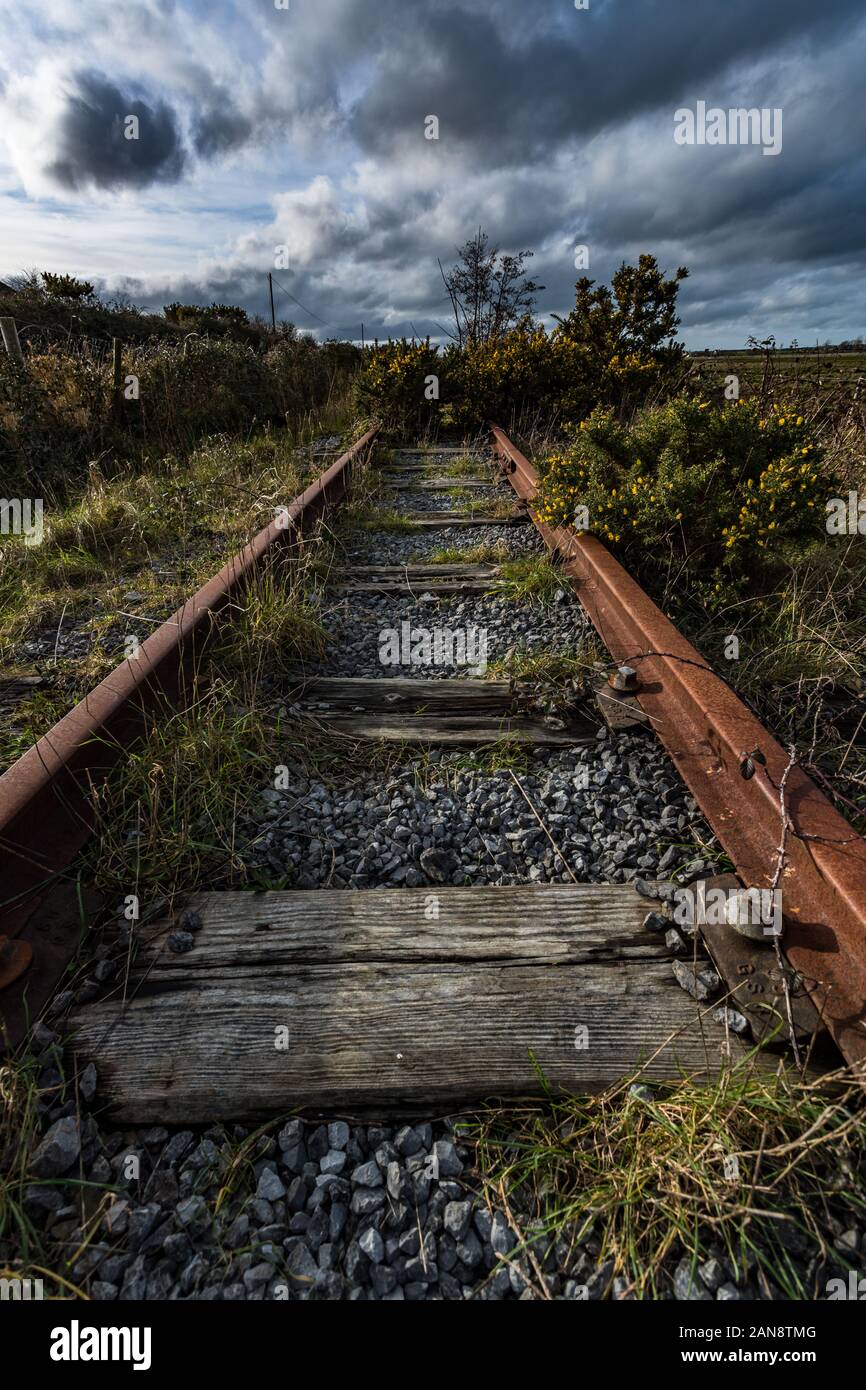 landscape of old unused and abandonned rusty train tracks in rural ...