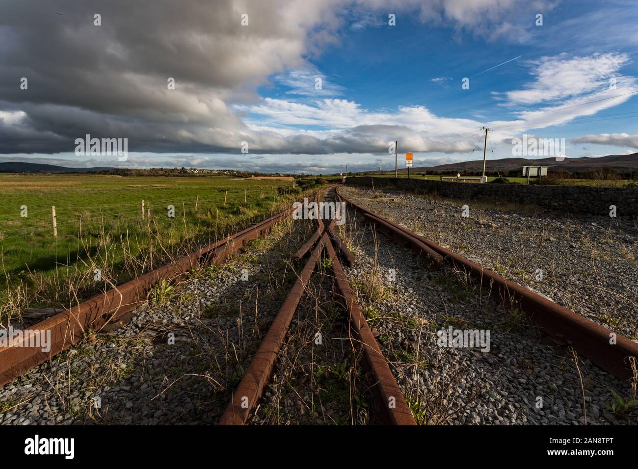 landscape of old unused and abandonned rusty train tracks in rural ...