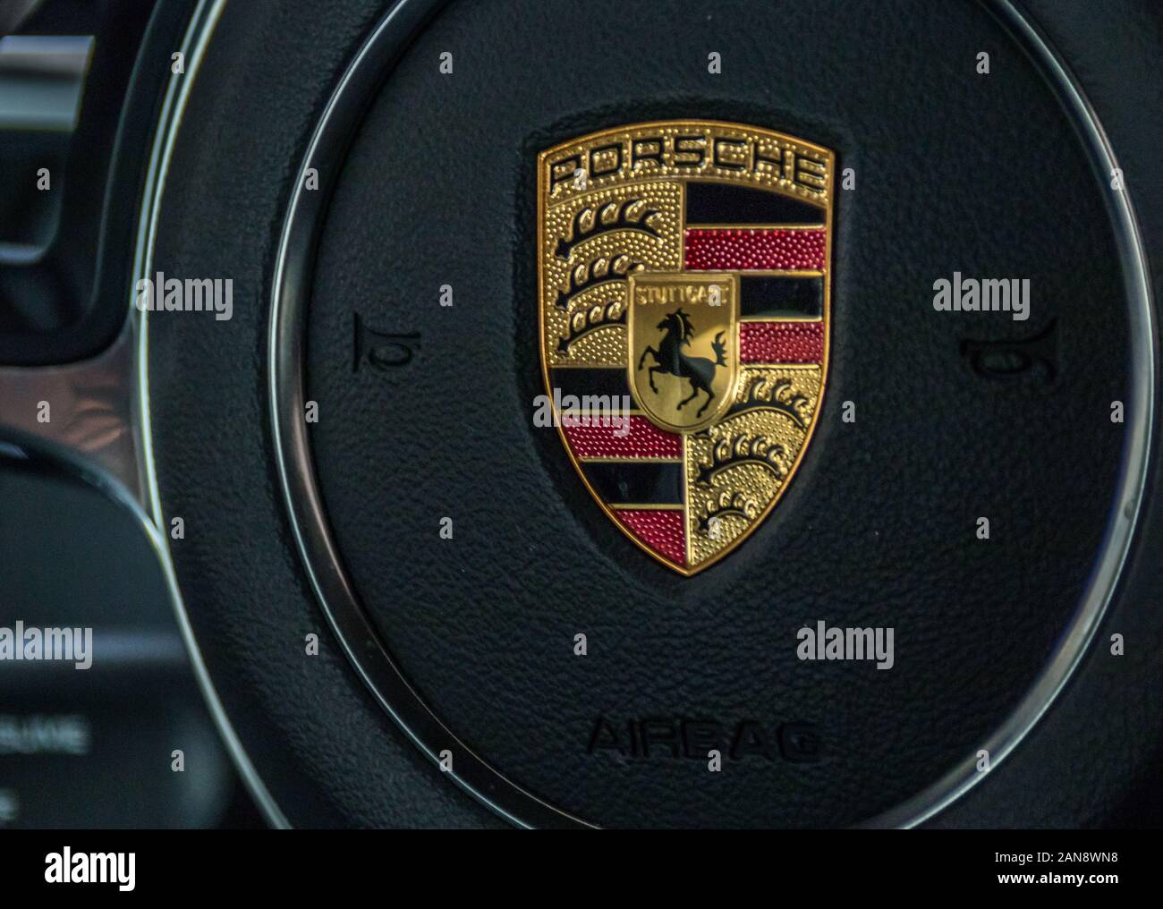 Closeup pf Porsche logo on steering wheel Stock Photo - Alamy