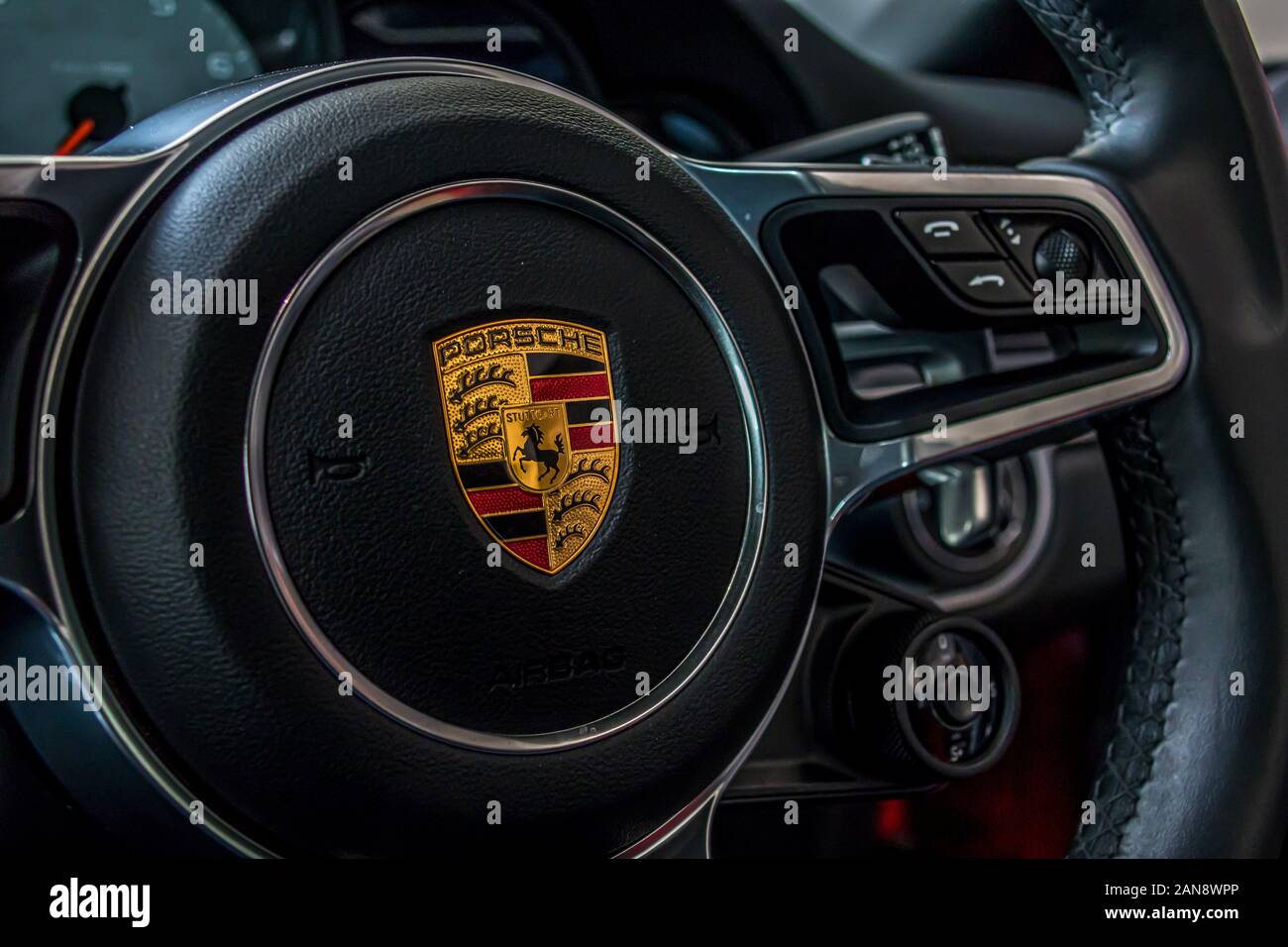Closeup pf Porsche logo on steering wheel Stock Photo - Alamy