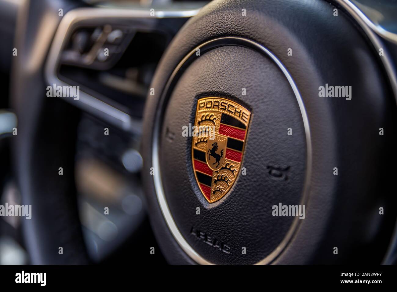 Closeup pf Porsche logo on steering wheel Stock Photo - Alamy