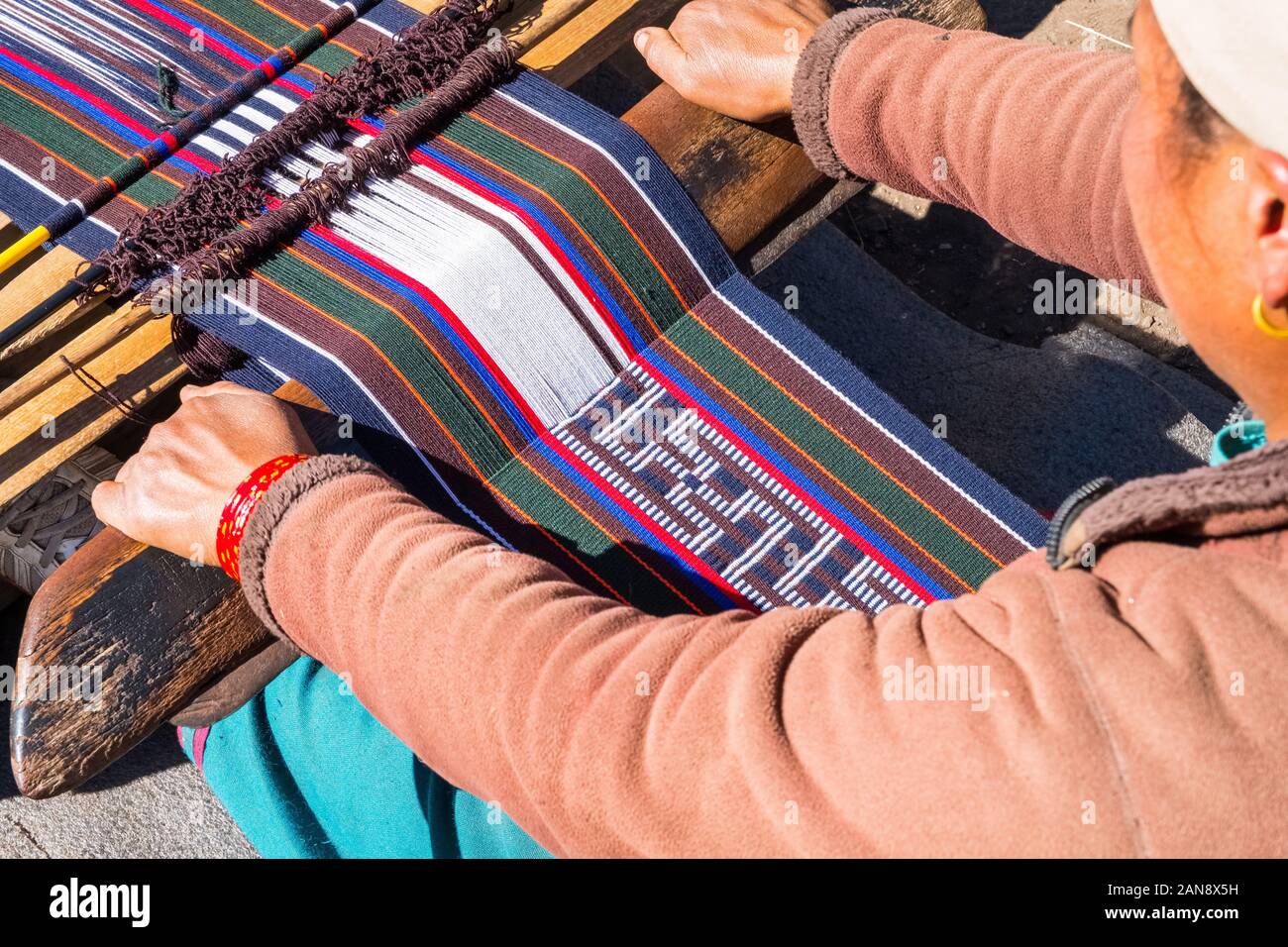 Tibetan woman weaving a traditional pattern, Dolpo, Nepal Stock Photo ...