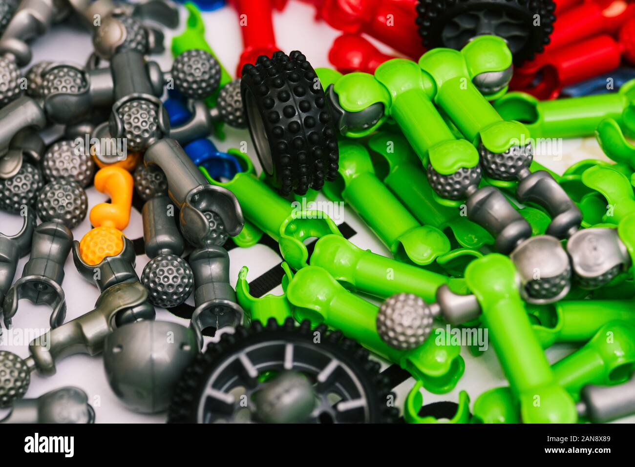 Gray and green details of the designer for the construction of a toy ...