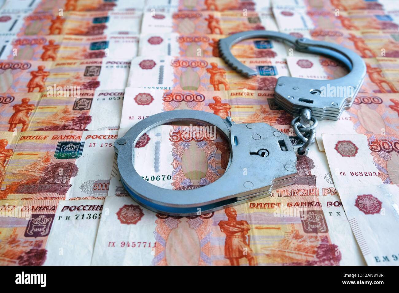 Cash bills and handcuffs. Bribe. Corruption crime. Anti-bribery concept ...