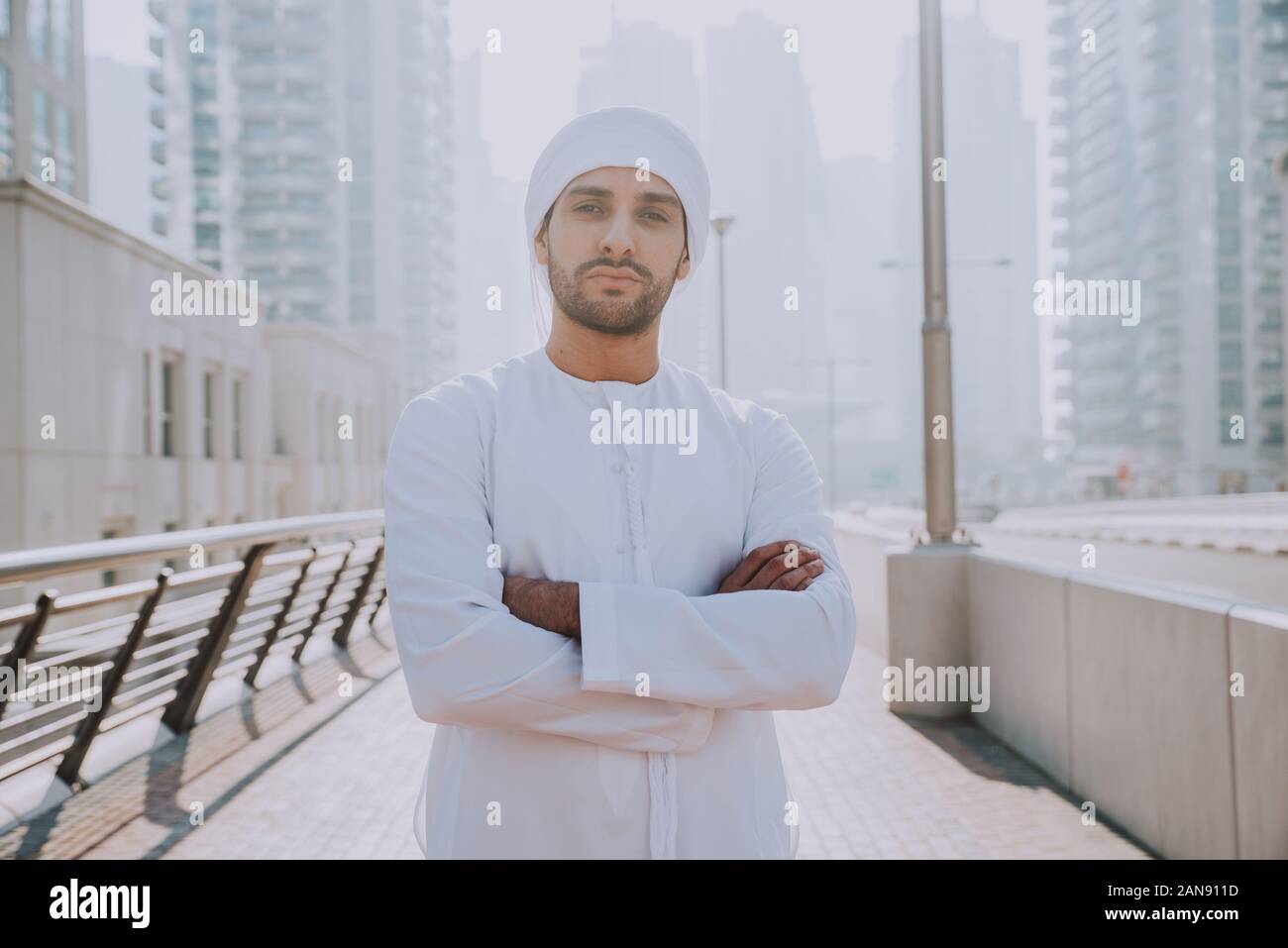 Beautiful middle eastern man wearing kandora traditional outfit in ...