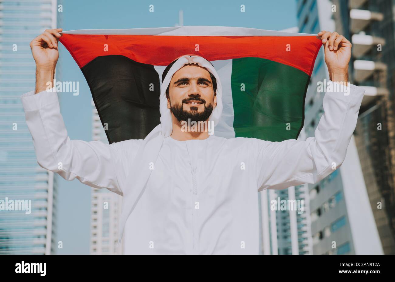 Beautiful middle eastern man wearing kandora traditional outfit in ...
